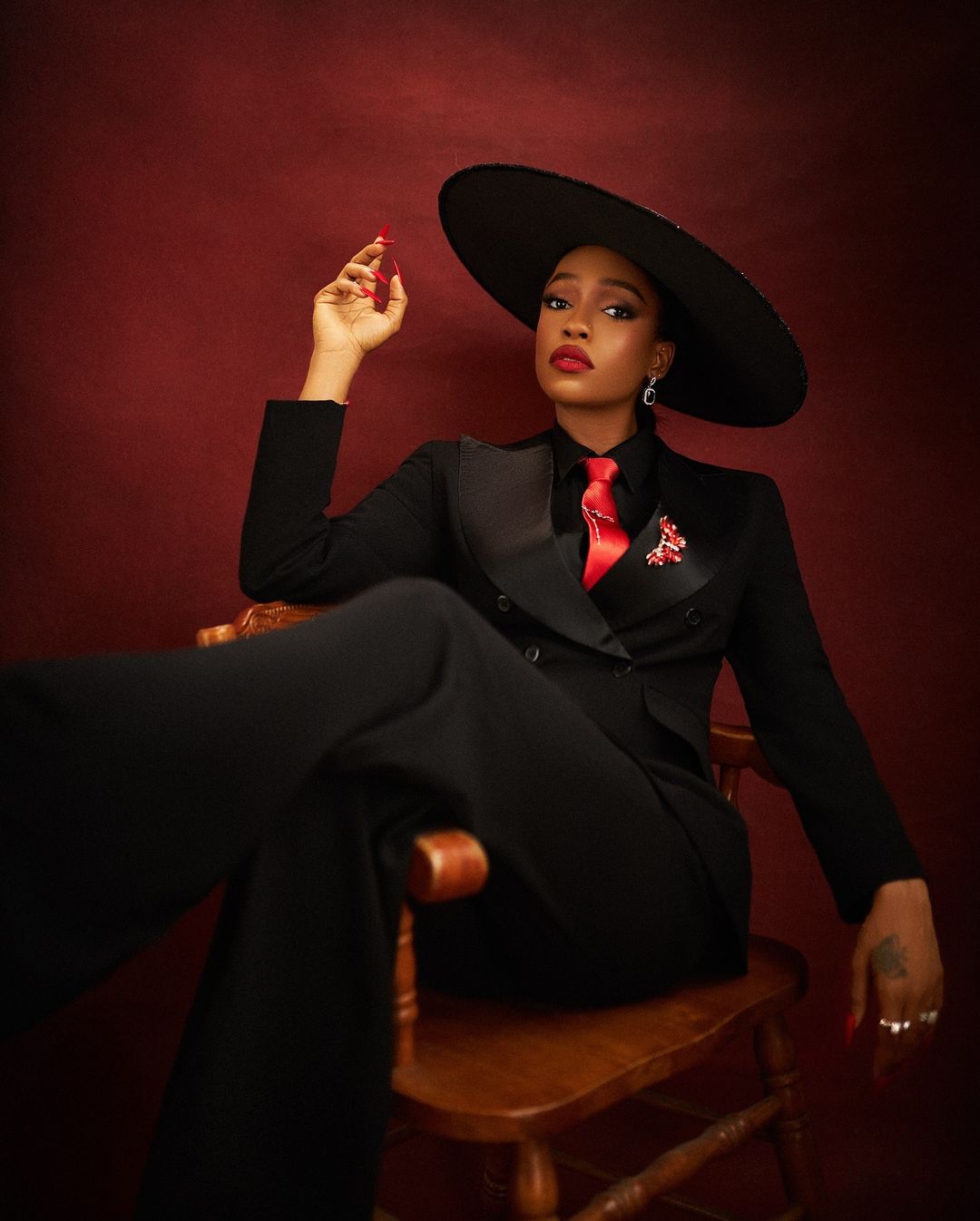 Efe Irele in a Black Suit and Red Tie is a Chic Twist to Power Dressing ...