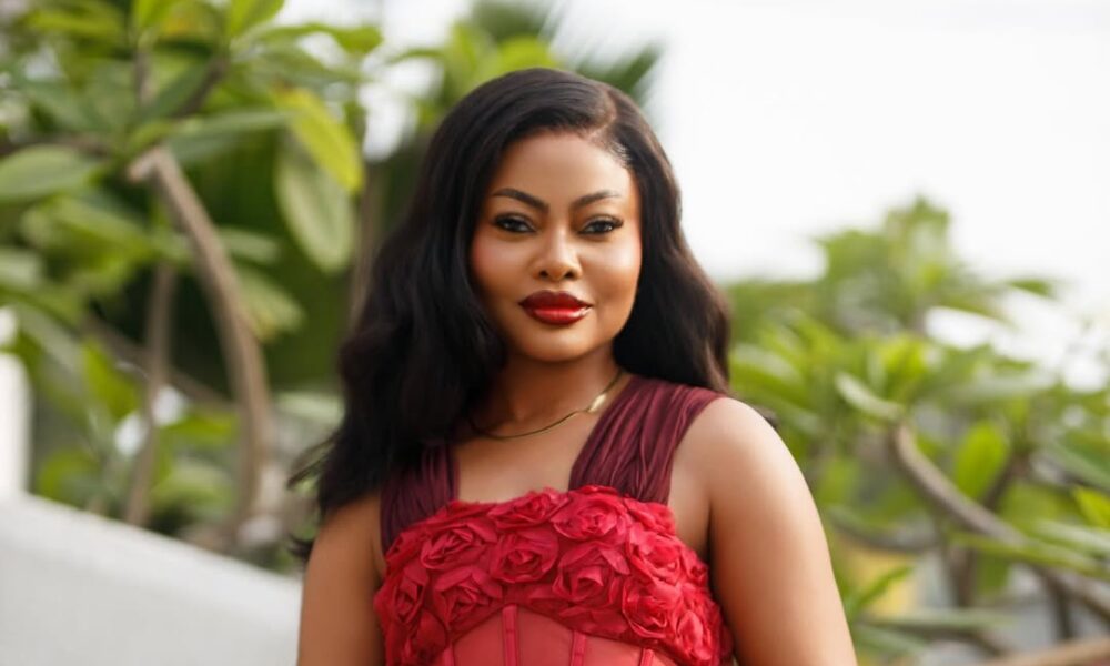 Teniola Aladese stuns in a red mini dress with floral appliqués and a ...